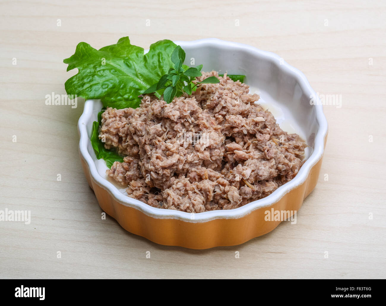 Canned tuna fillet for salad on the wod bckground Stock Photo - Alamy