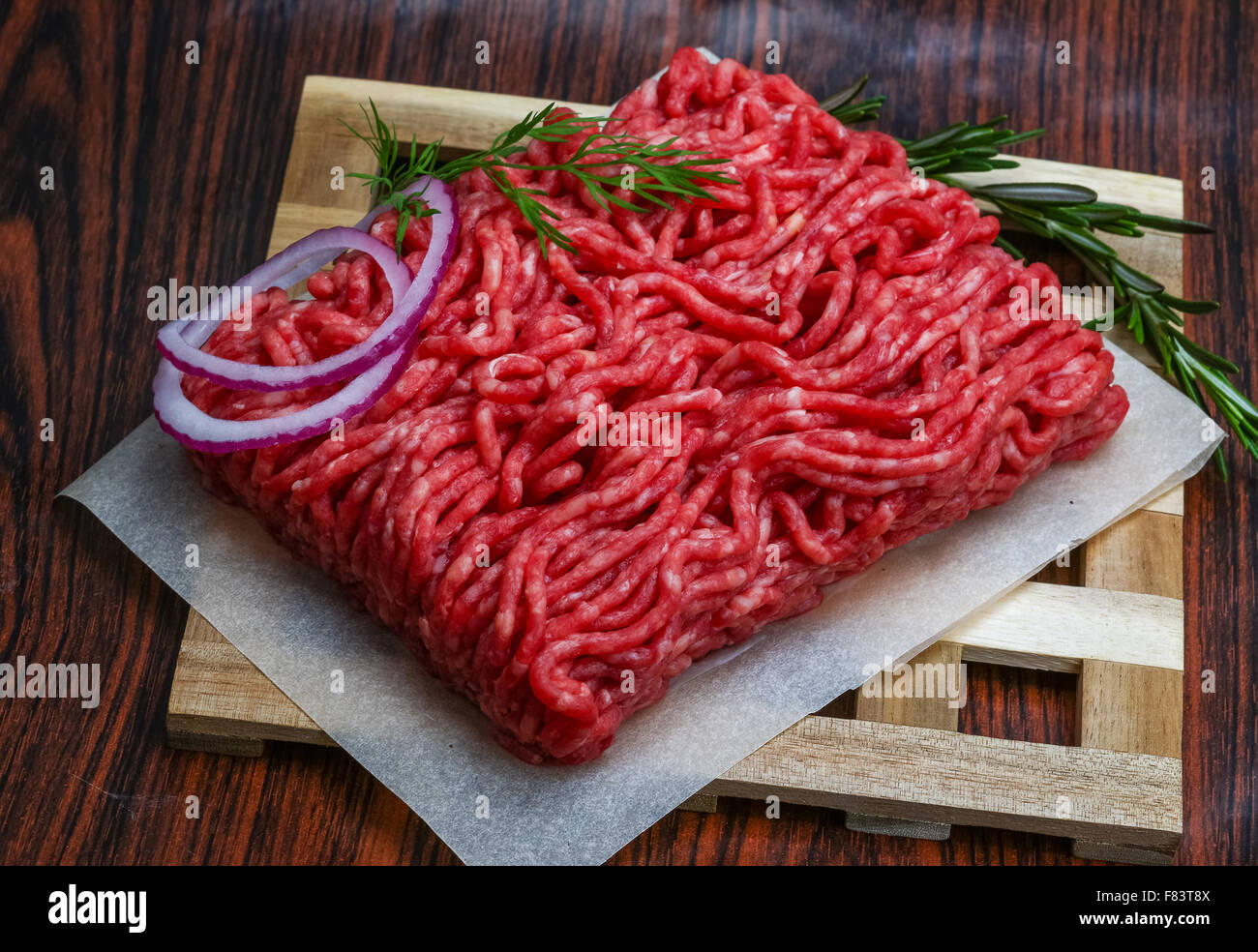 Raw beef minced meat with rosemary and onion Stock Photo - Alamy