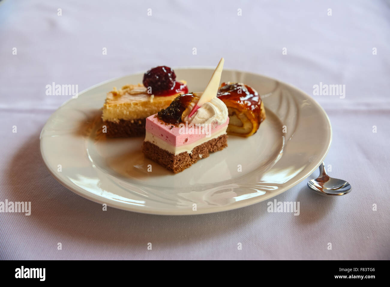 Mini cakes with berries and sweet cream Stock Photo - Alamy