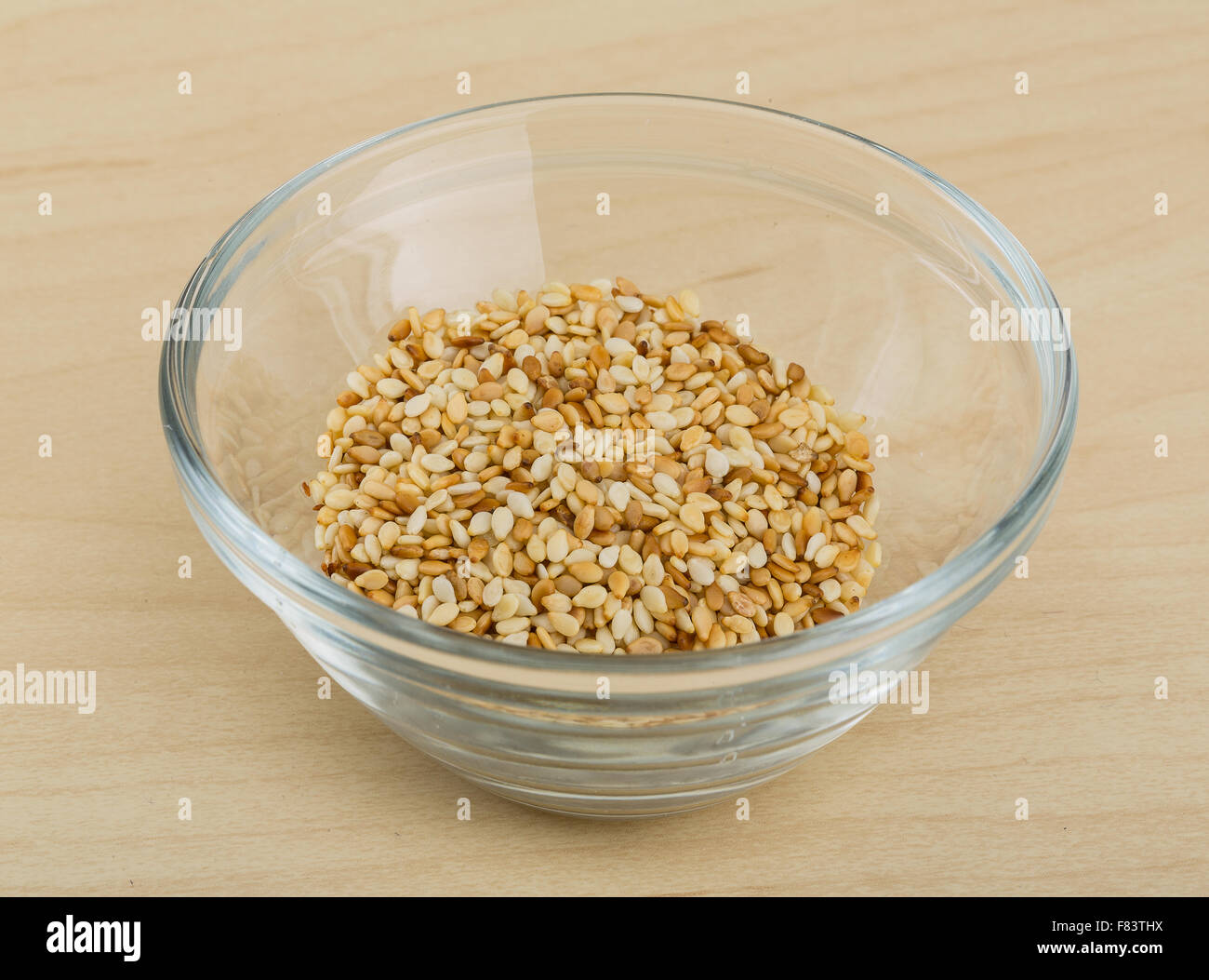 Roasted sesame seeds on the wood background Stock Photo - Alamy