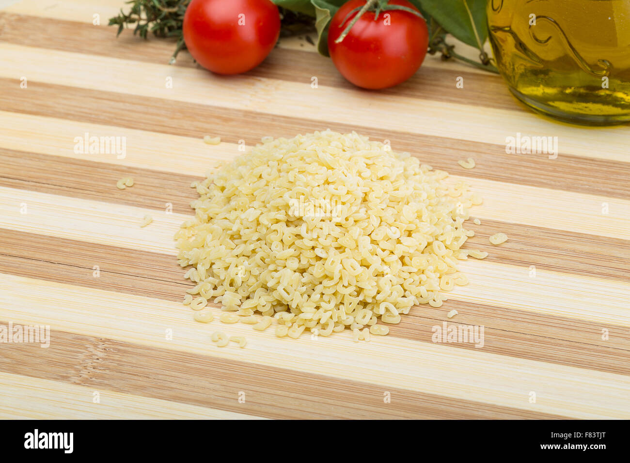 Raw ABC macaroni on the wood background Stock Photo - Alamy