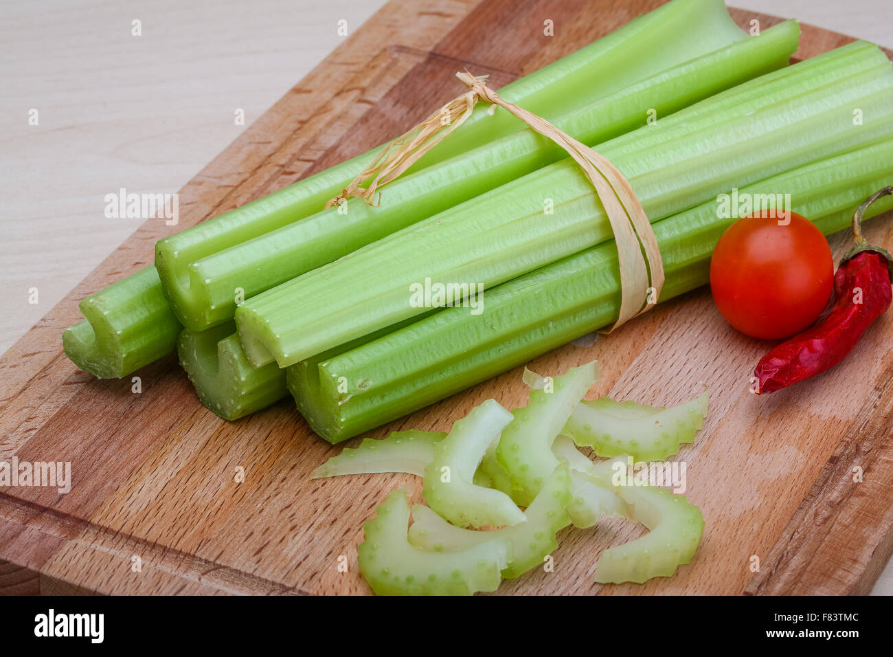 Fresh Green Celery sticks on the wood background Stock Photo - Alamy