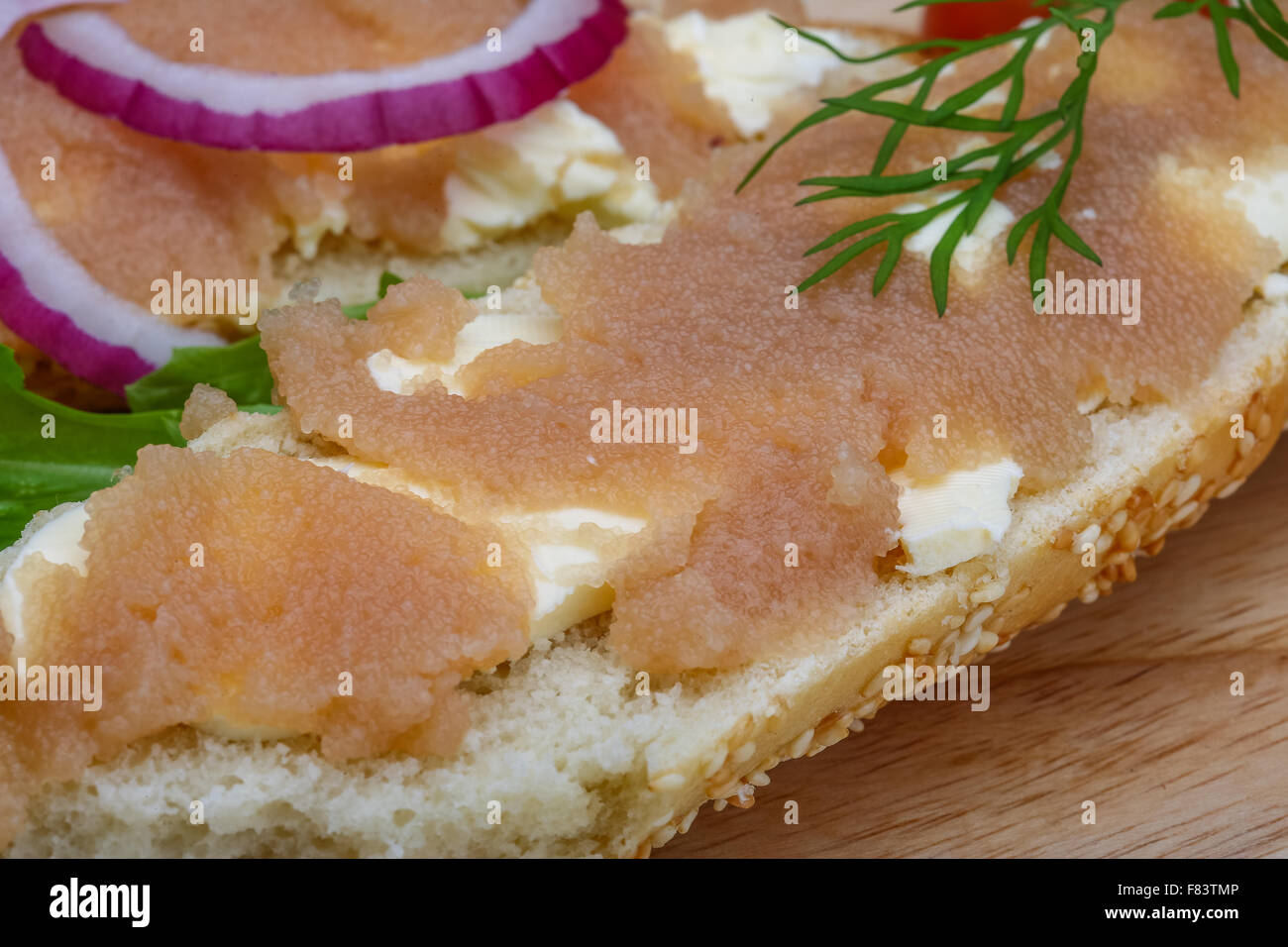 Sandwich with cod roe, salad, onion and dill Stock Photo - Alamy