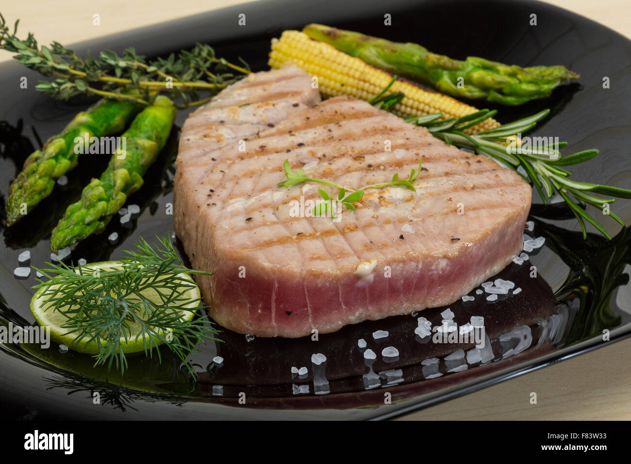 Grilled Tuna steak with asparagus and roseary Stock Photo - Alamy