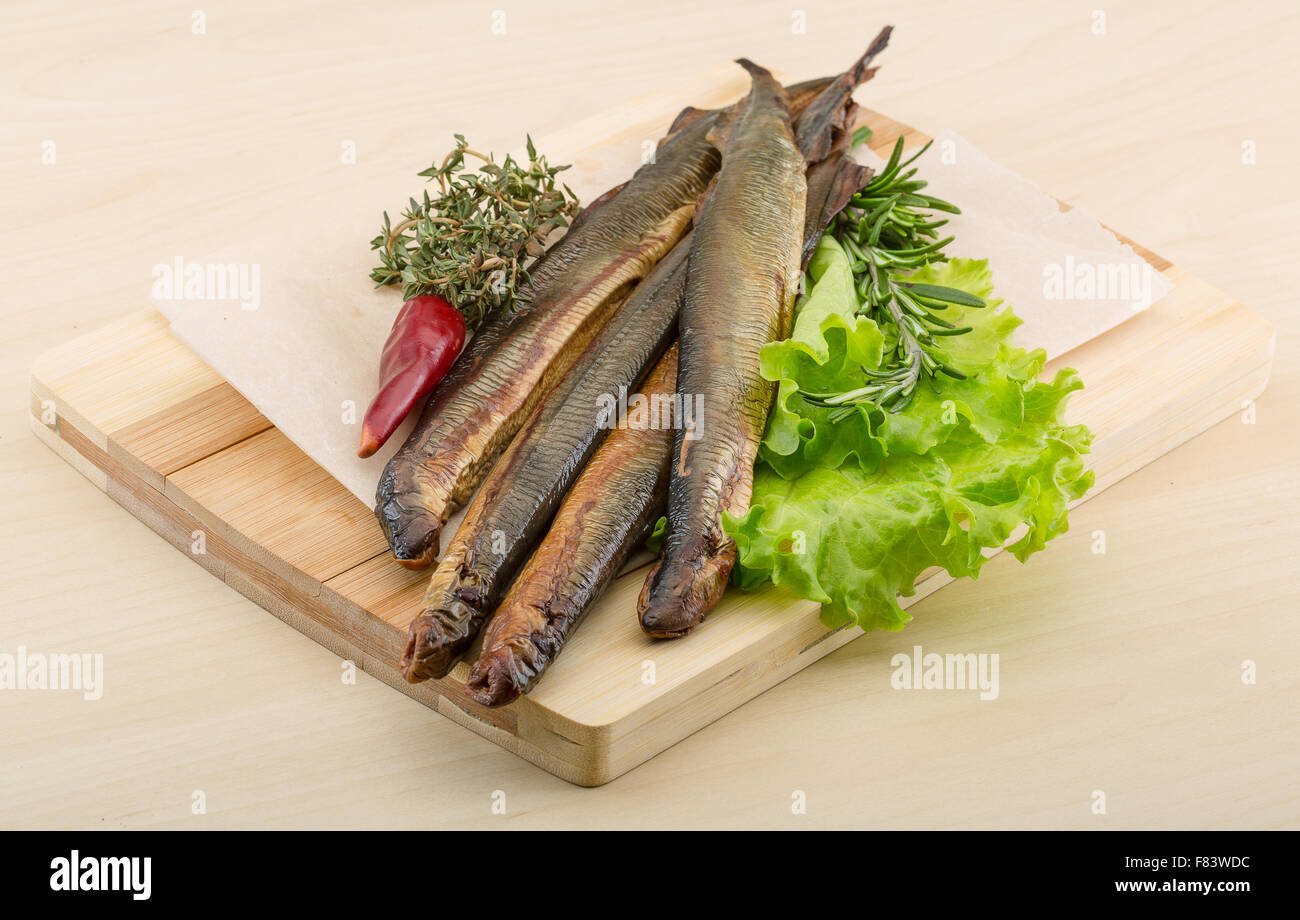 Smoked Lamprey - seafood delicacy with salad and herbs Stock Photo - Alamy