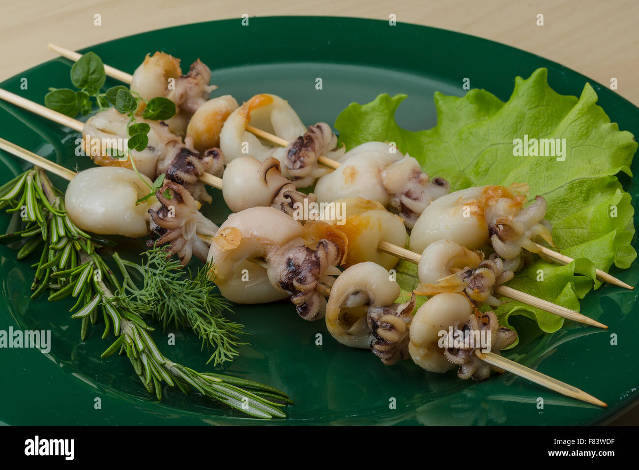 Grilled cuttlefish bbq with rosemary and pepper Stock Photo - Alamy