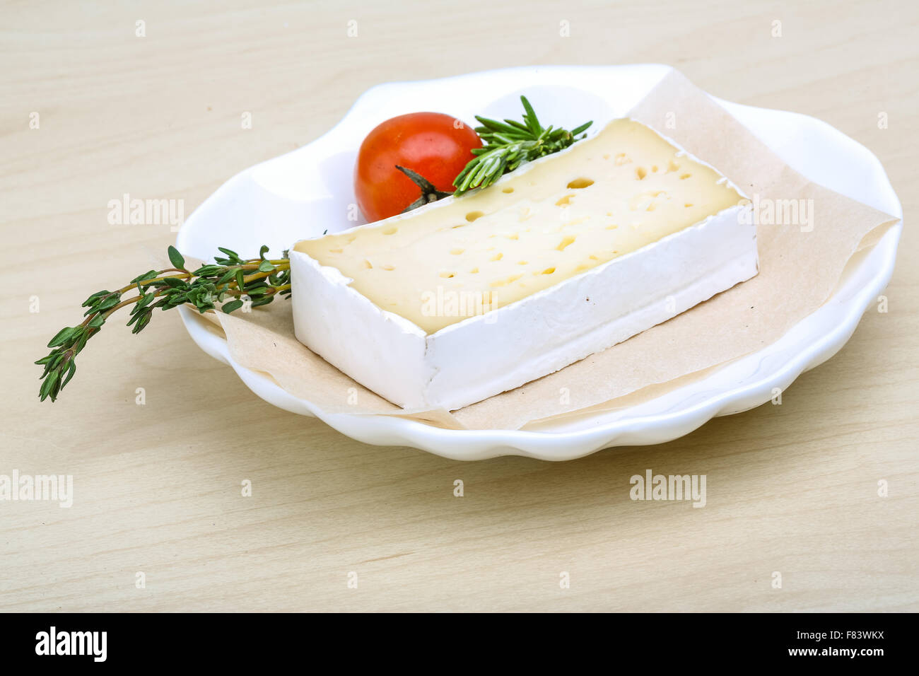 Soft brie cheese with rosemary, thyme and toast bread Stock Photo - Alamy
