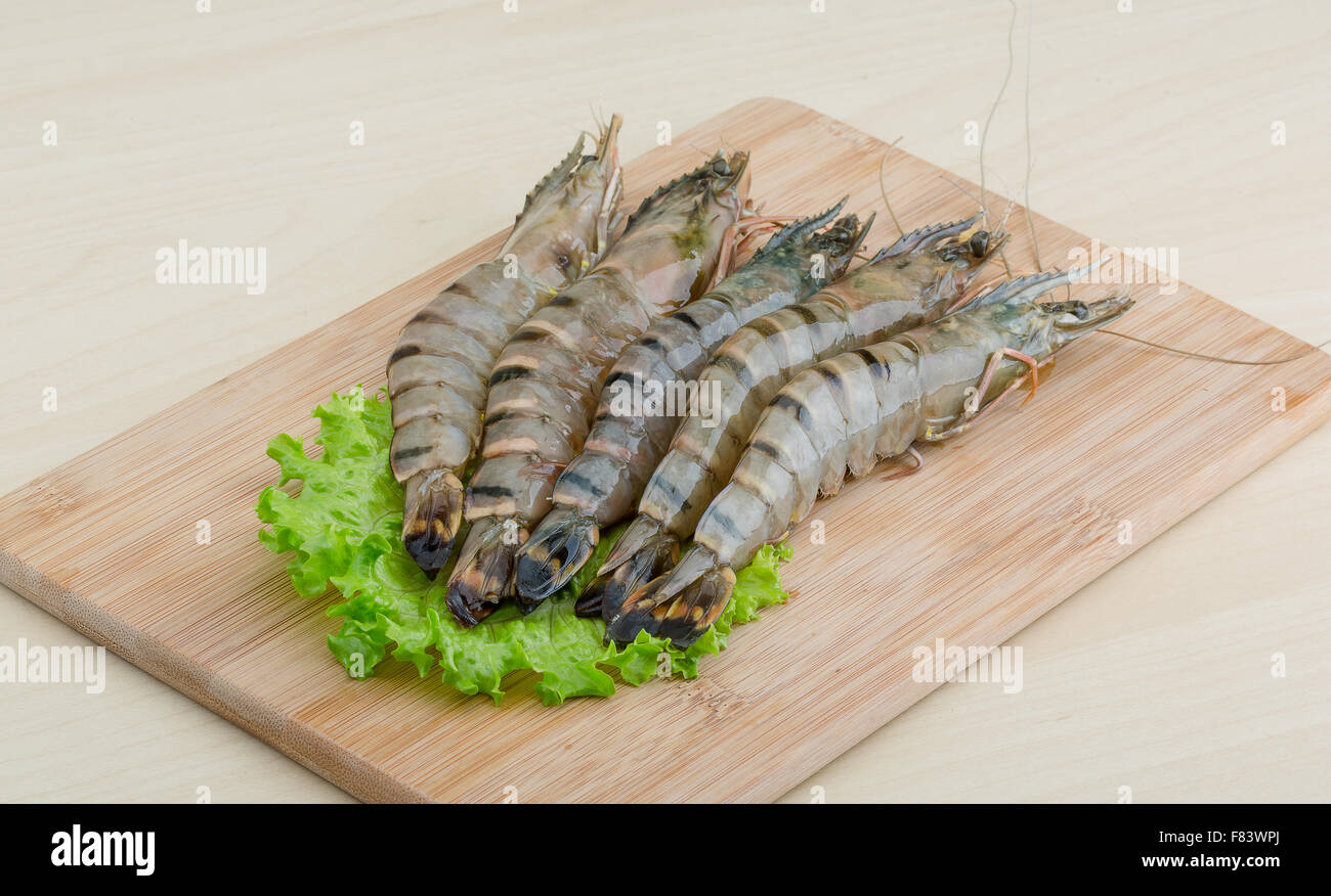 Raw tiger shrimps on the wood board Stock Photo - Alamy