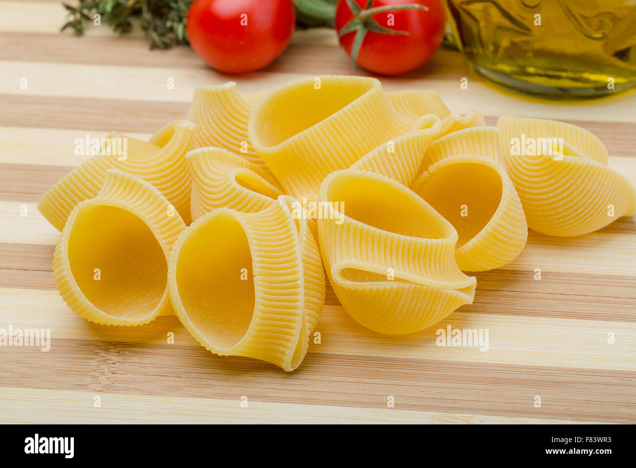 Pipe rigate pasta on the wood background Stock Photo - Alamy