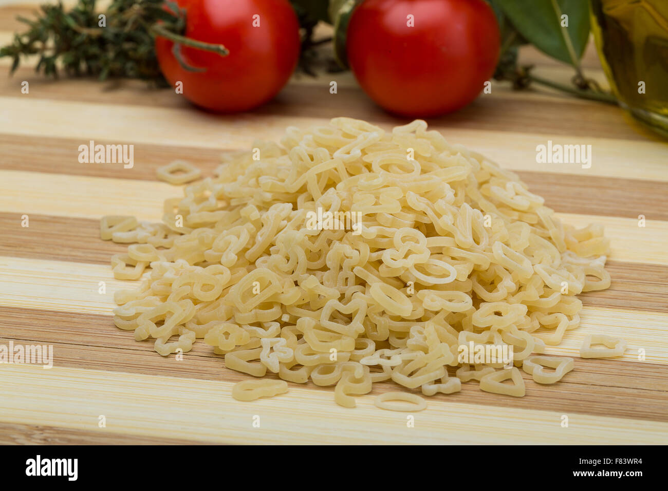 Raw ABC macaroni on the wood background Stock Photo - Alamy