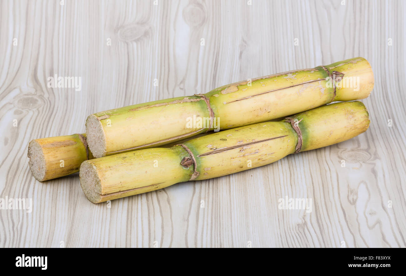 Sugar reed sticks on the wooden background Stock Photo - Alamy