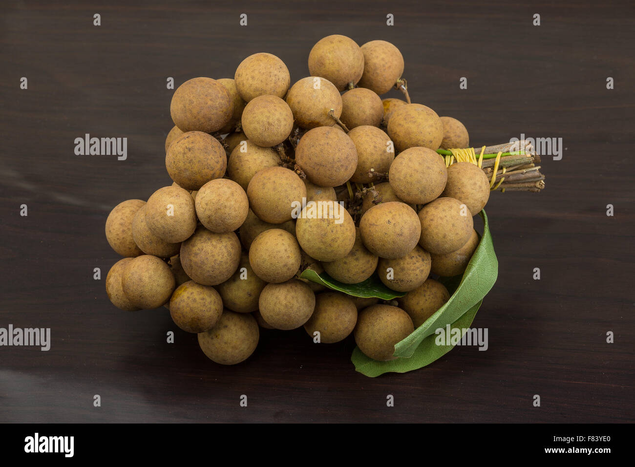 Asian fruit Longan - on wood background Stock Photo - Alamy
