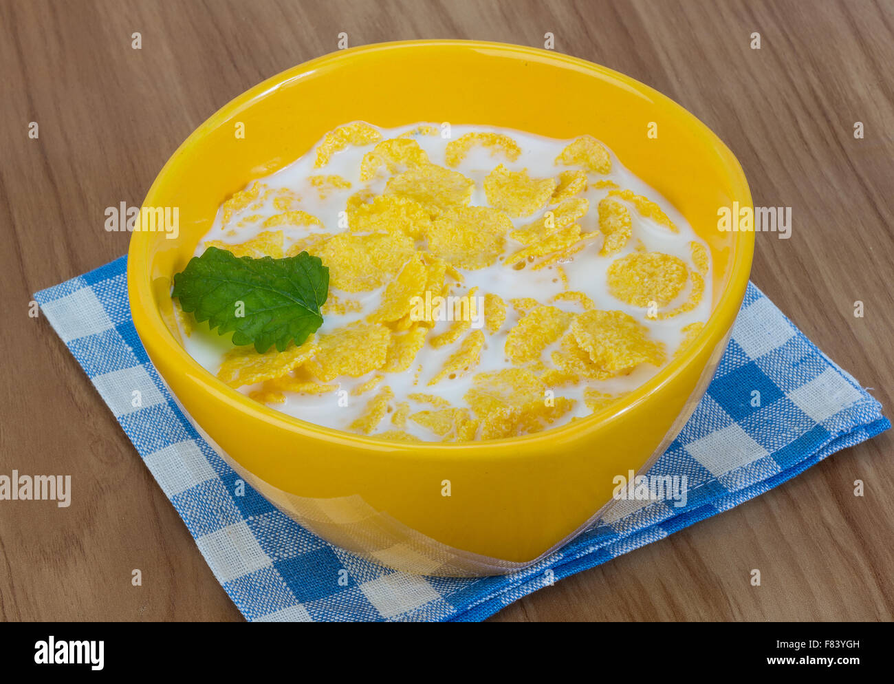 Morning food - cornflakes with milk on the napkin Stock Photo - Alamy