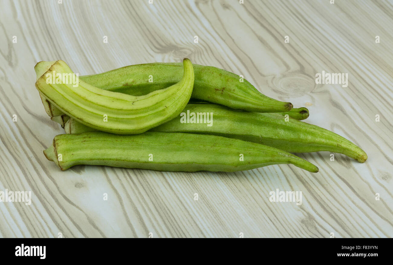 Asian vegetable - okra on the wood background Stock Photo - Alamy