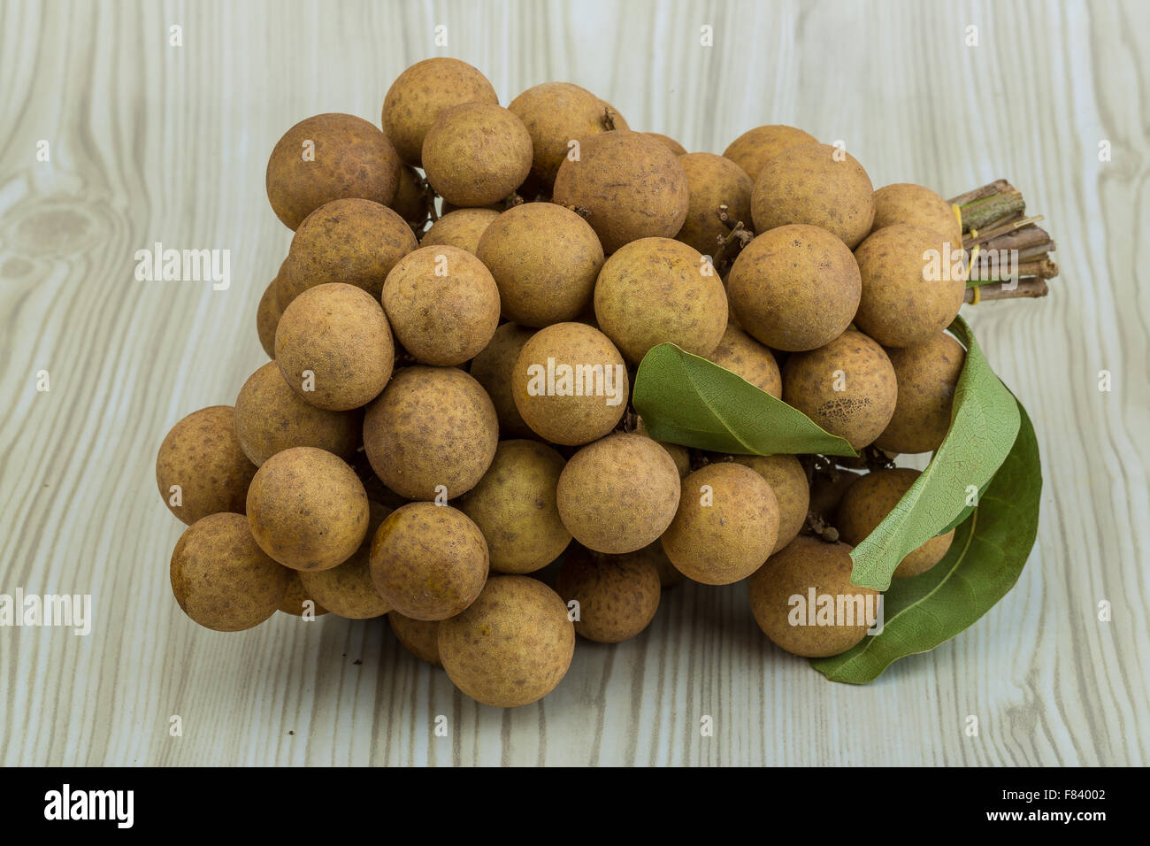 Asian fruit Longan - on wood background Stock Photo - Alamy
