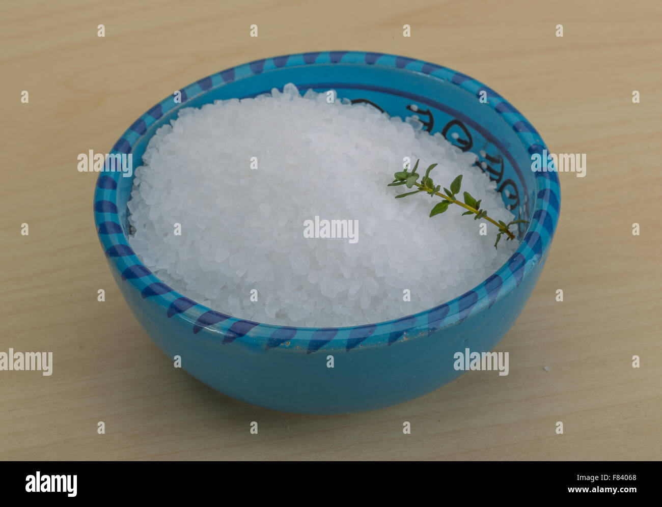 Sea salt heap crystal with thyme branch Stock Photo - Alamy