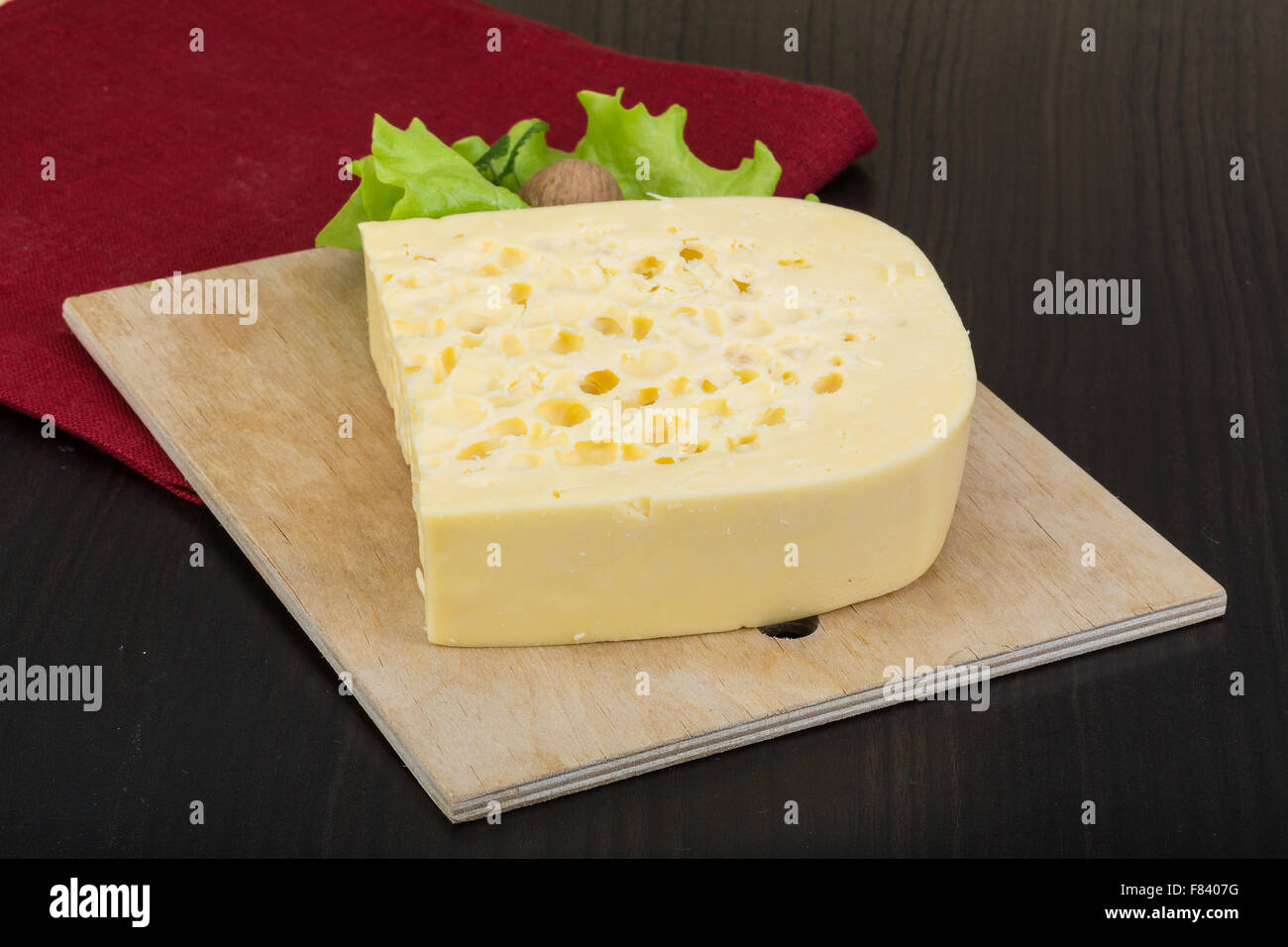 Yellow cheese - maasdam with salad leaves Stock Photo - Alamy