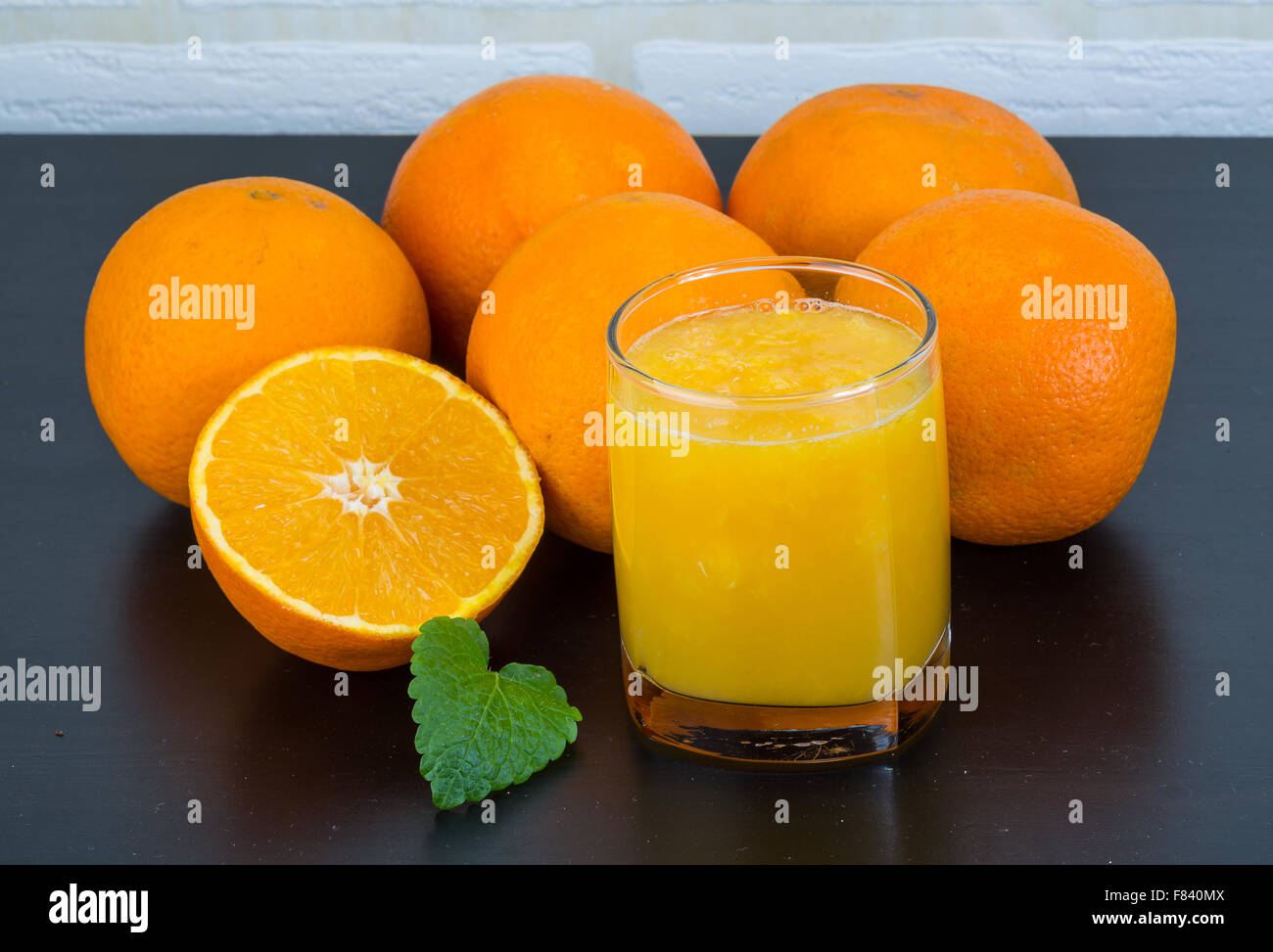 Fresh made Orange juice with ripe fruits Stock Photo - Alamy