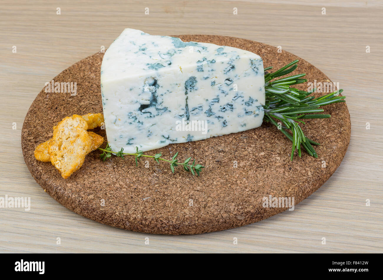 Blue cheese with mold on the wood background Stock Photo - Alamy