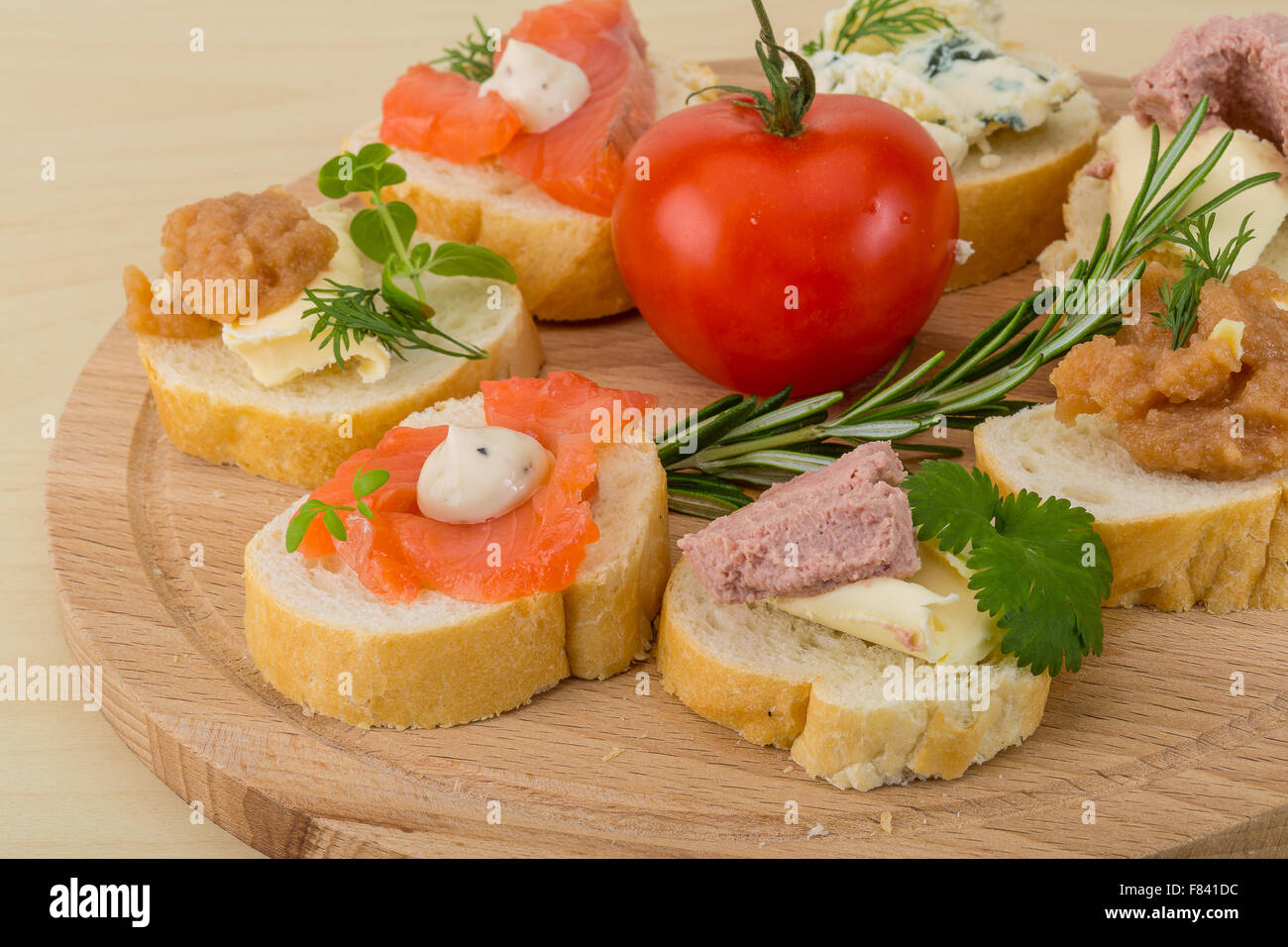 Assorted tapas with fish, blue cheese, caviar and liver Stock Photo - Alamy