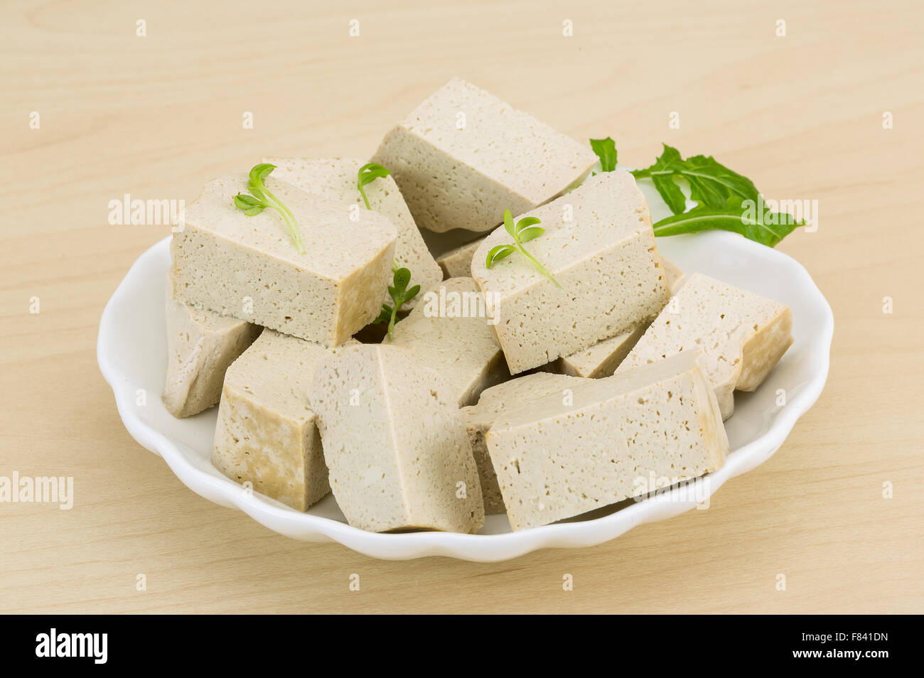 Tofu - soya cheese with herbs on the wood background Stock Photo - Alamy