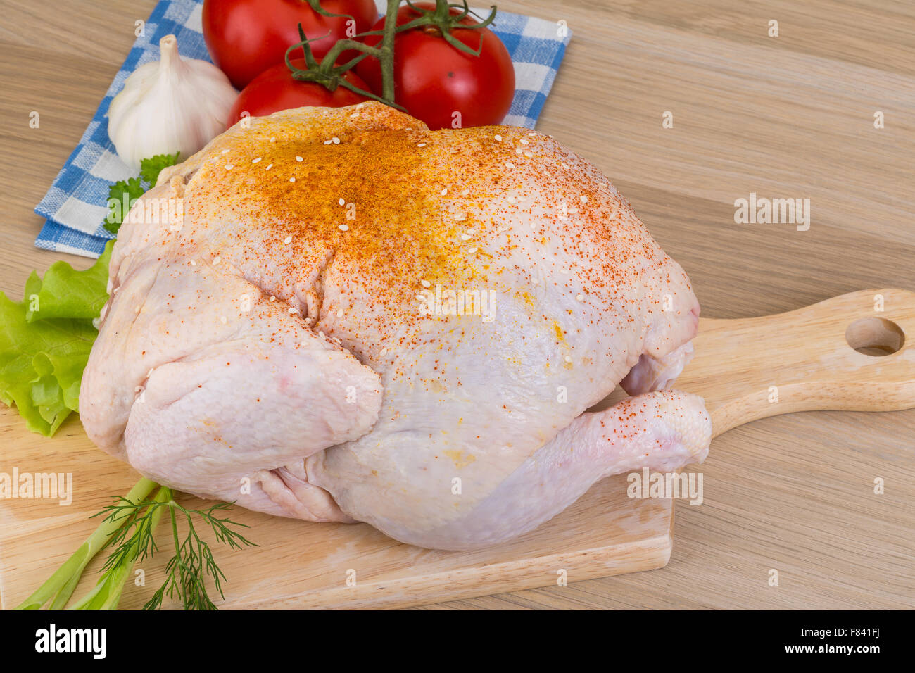 Raw chicken with herbs and spices ready for cooking Stock Photo - Alamy