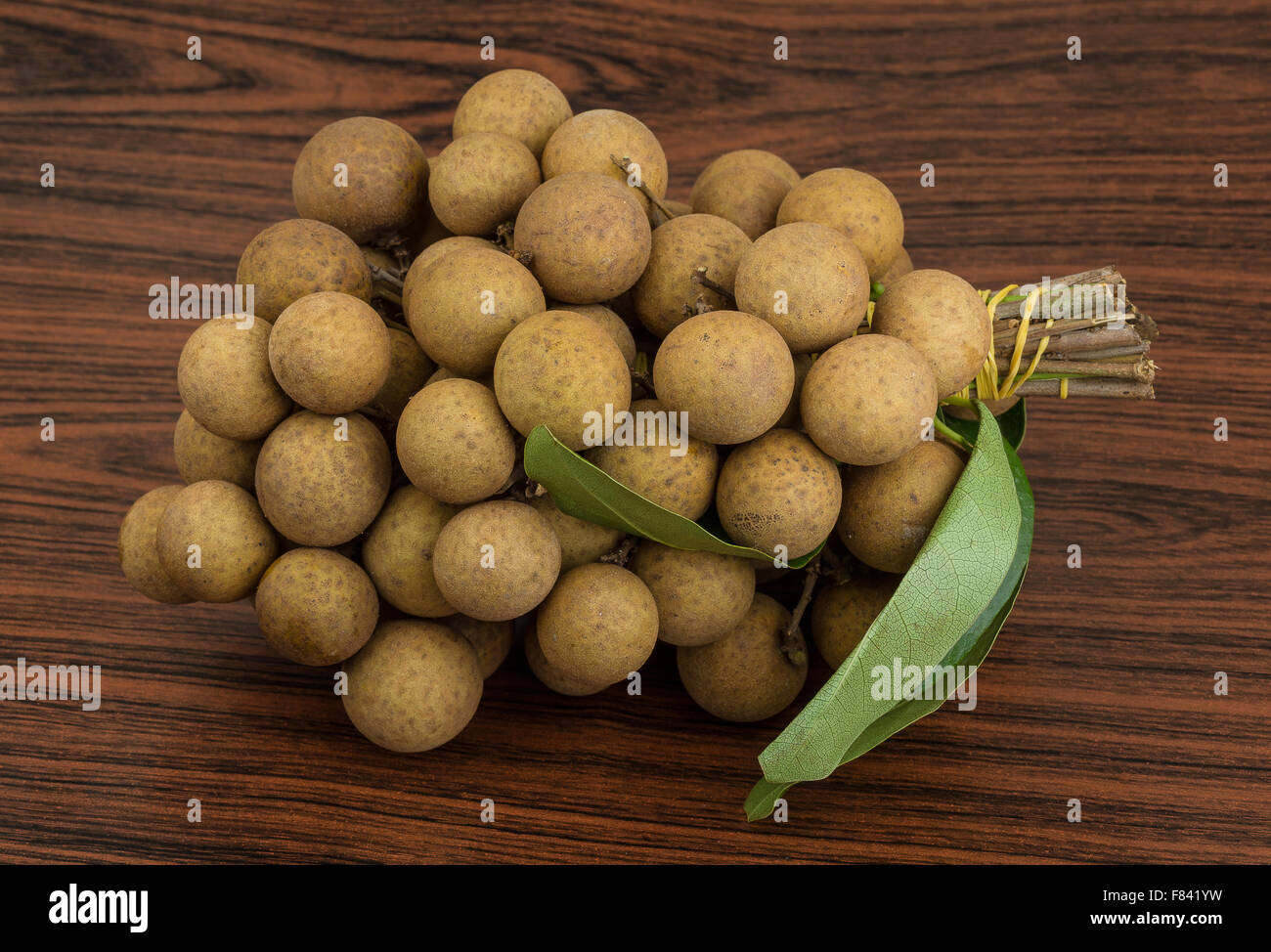 Asian fruit Longan - on wood background Stock Photo - Alamy