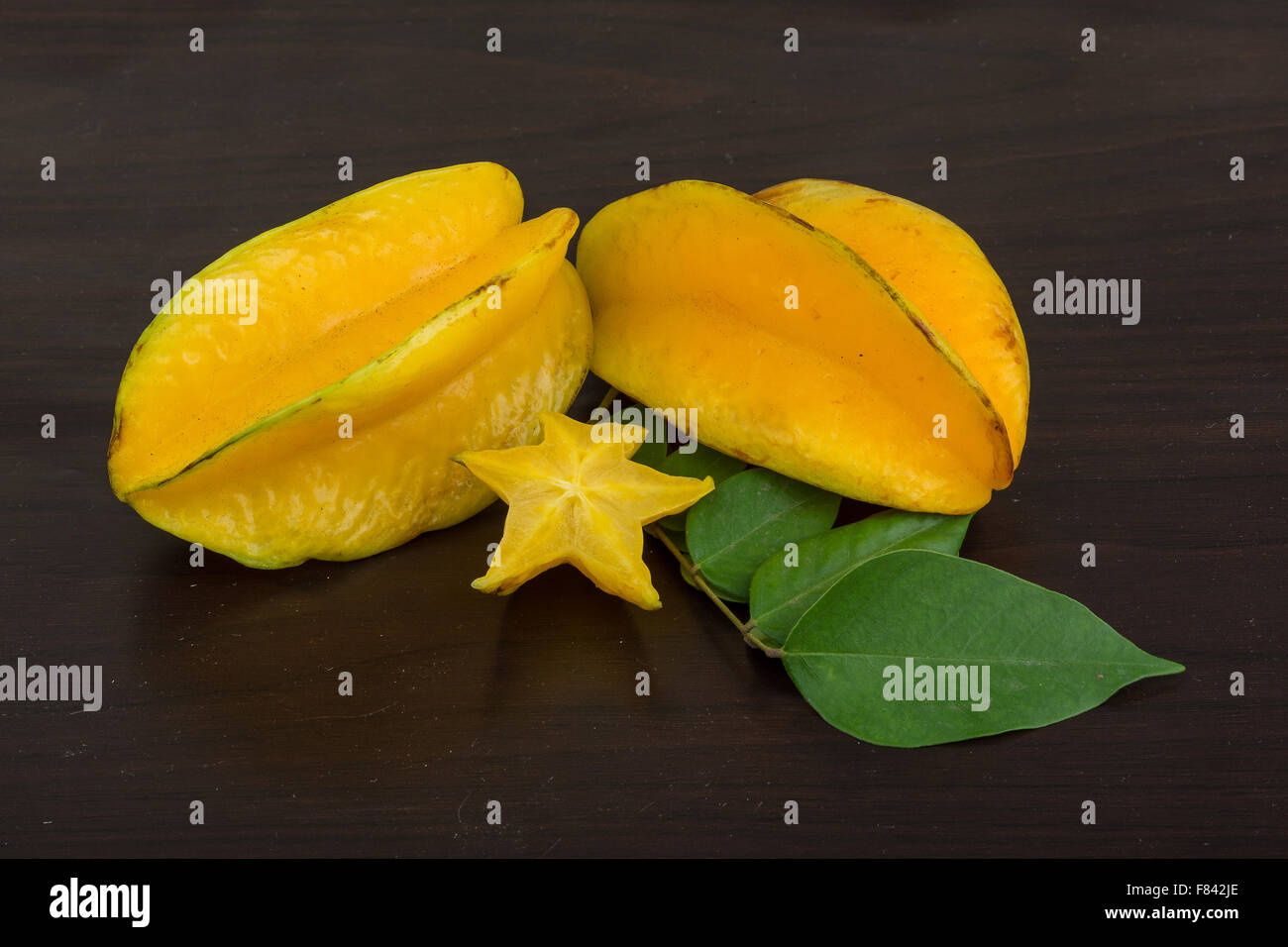 Asian fruit Carambola with leaves - for styling food Stock Photo - Alamy
