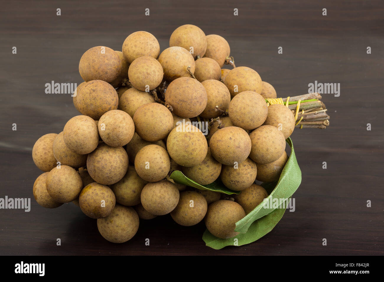 Asian fruit Longan - on wood background Stock Photo - Alamy
