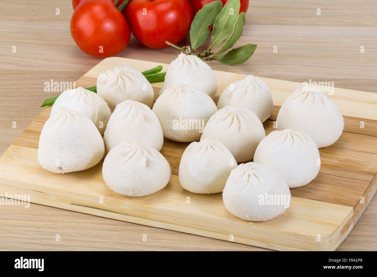 Georgian dumplings - Khinkali with minced meat and herbs Stock Photo ...