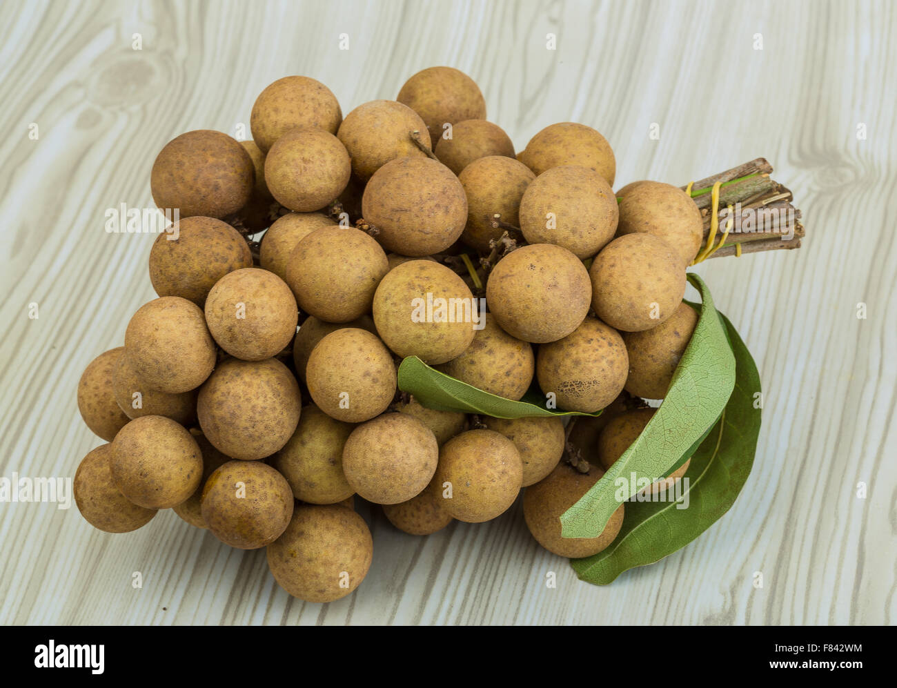 Asian fruit Longan - on wood background Stock Photo - Alamy