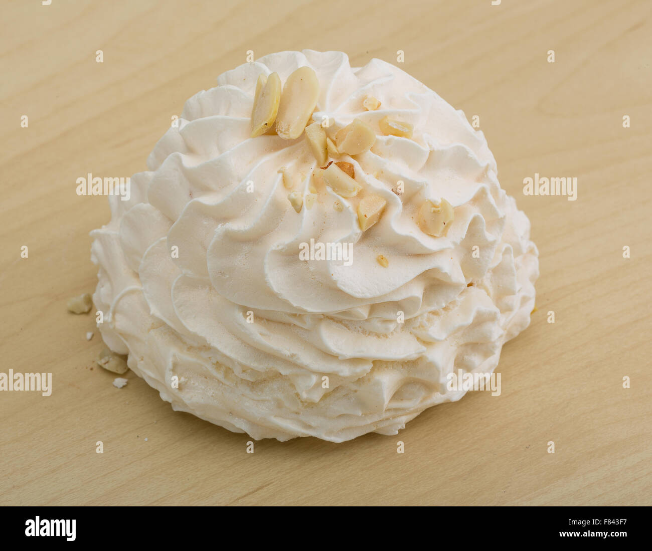 White meringue with nut on the wood background Stock Photo - Alamy
