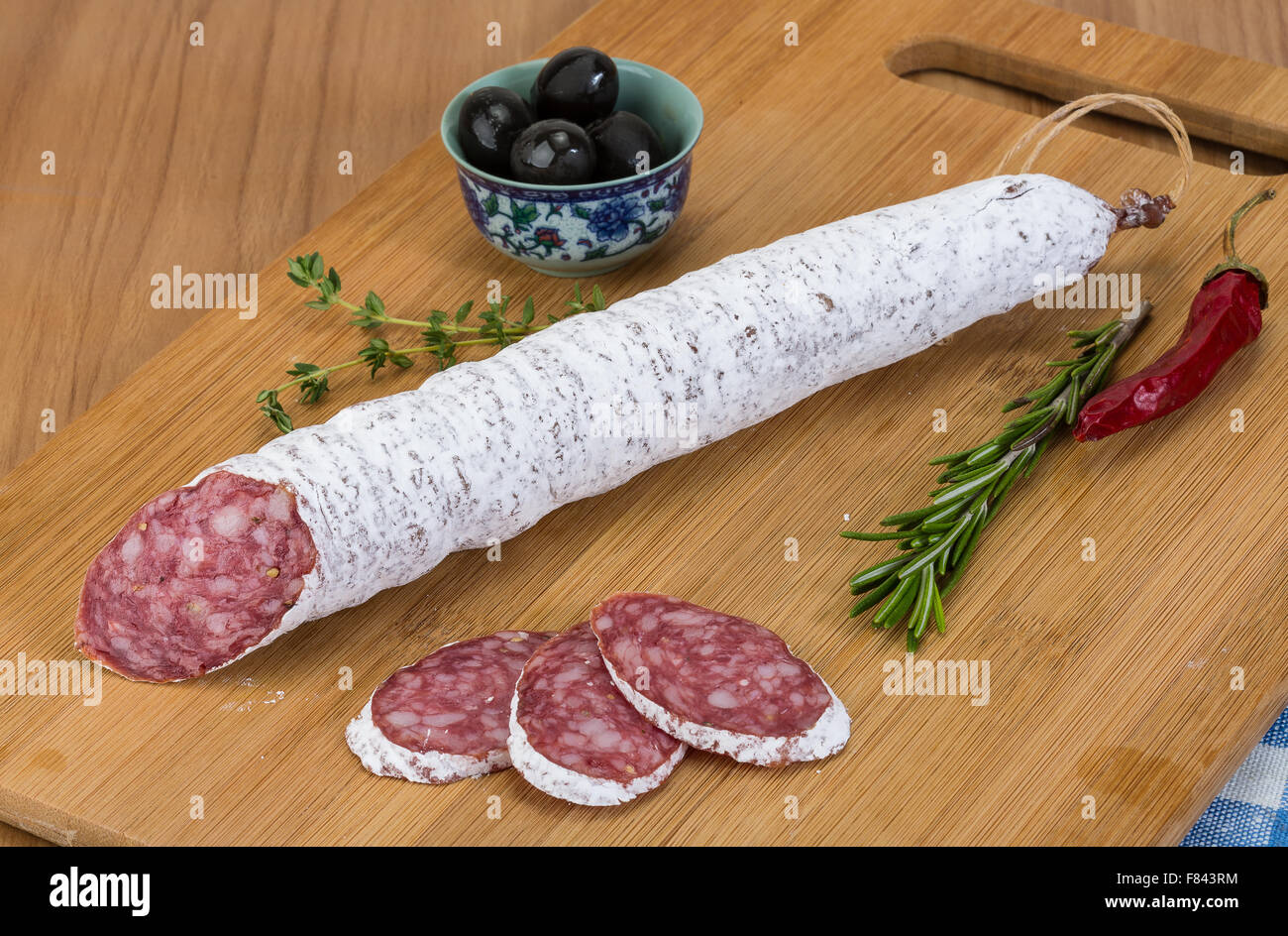 Fuet sausage - Spanish meat sliced with herbs Stock Photo - Alamy