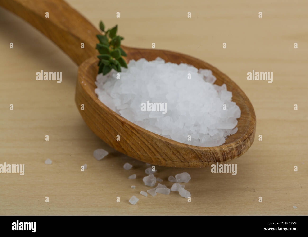 Sea salt heap crystal with thyme branch Stock Photo - Alamy