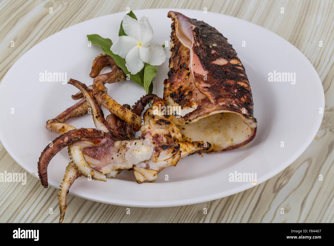 Grilled cuttlefish with spices in the bowl Stock Photo - Alamy