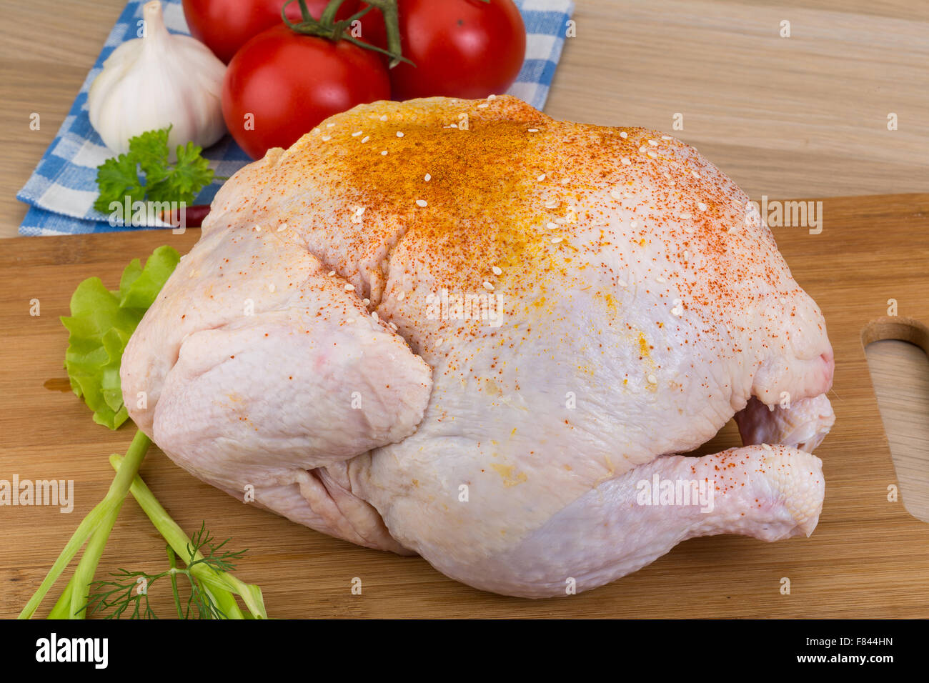 Raw chicken with herbs and spices ready for cooking Stock Photo - Alamy