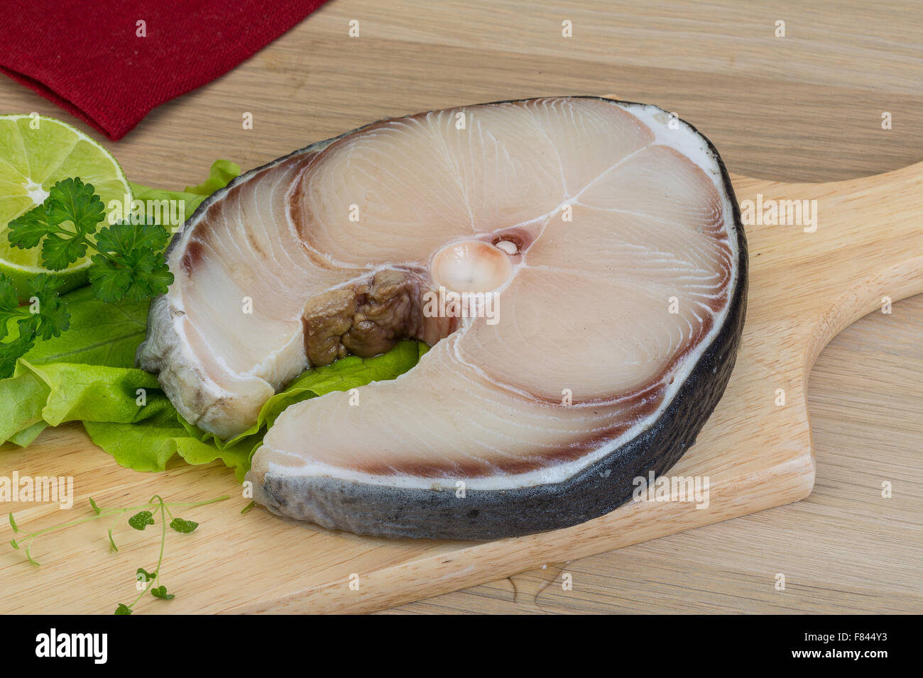 Raw blue shark steak with salad leaves and lime Stock Photo - Alamy