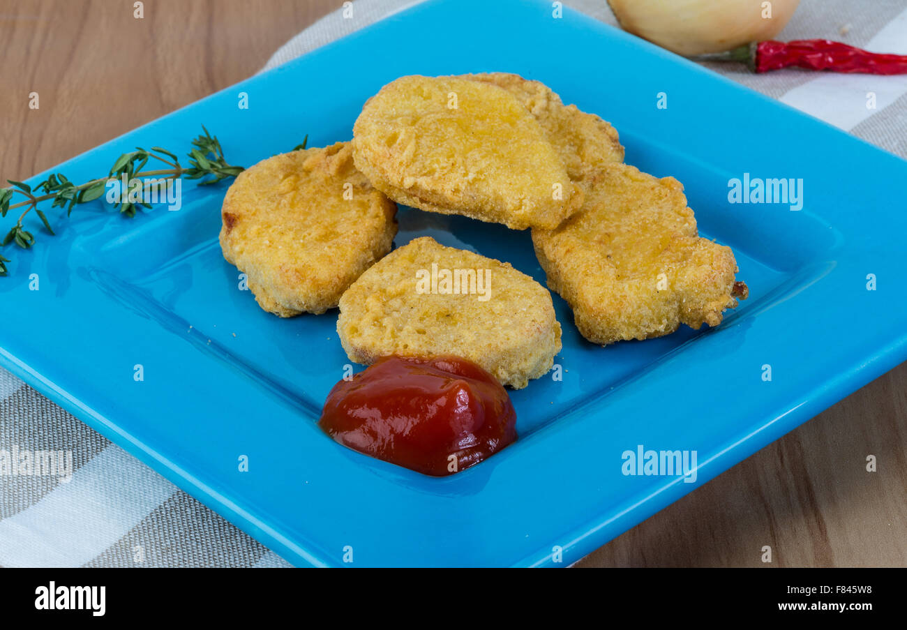 Chicken Nuggets in the blue plate with sauce Stock Photo - Alamy
