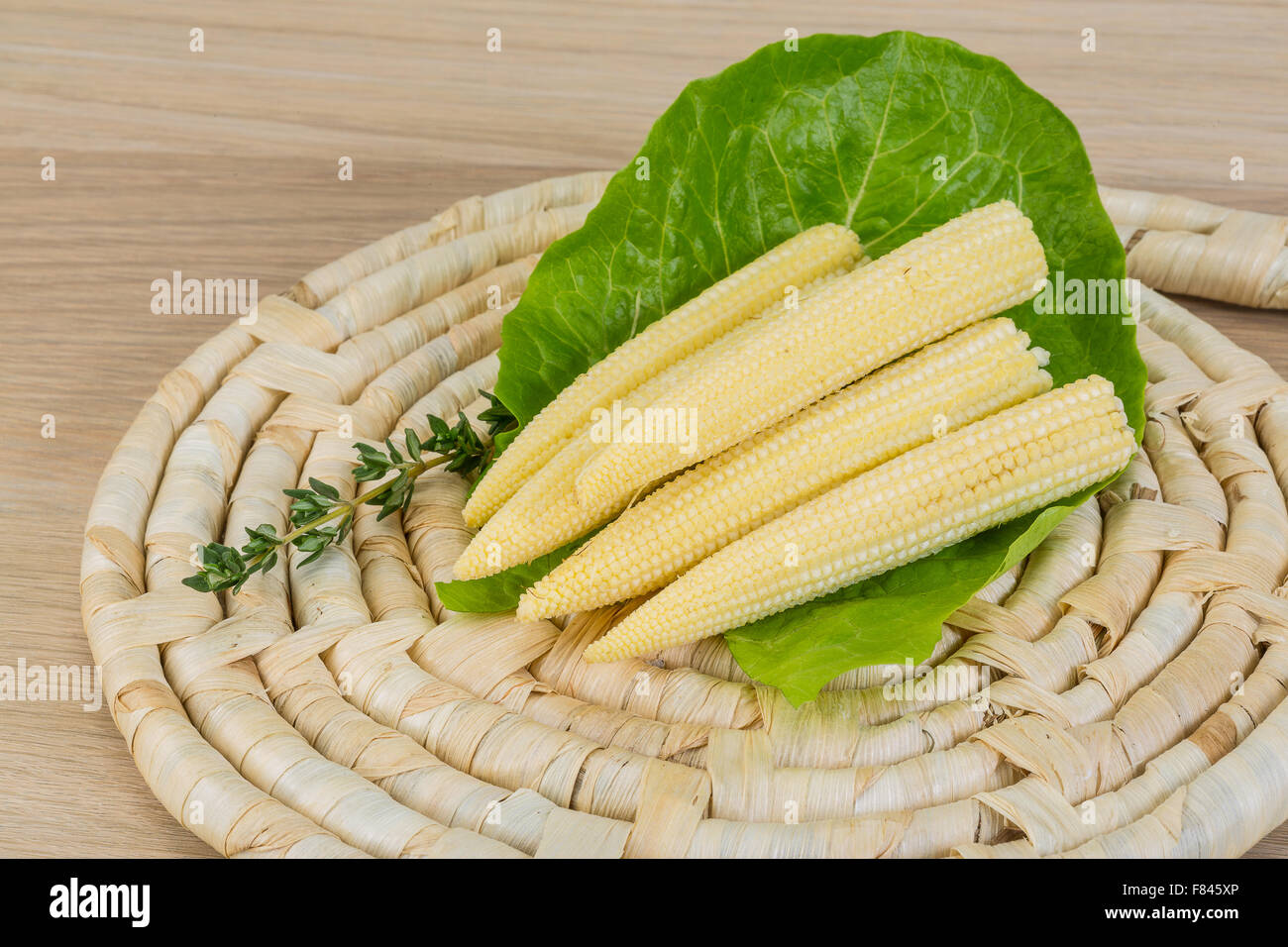 Fresh ripe Baby corn on the wood background Stock Photo - Alamy