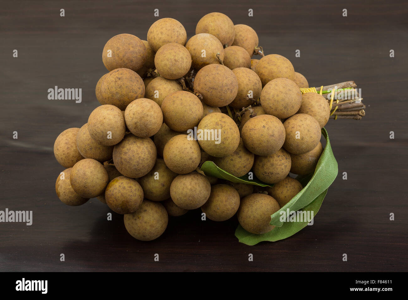 Asian fruit Longan - on wood background Stock Photo - Alamy