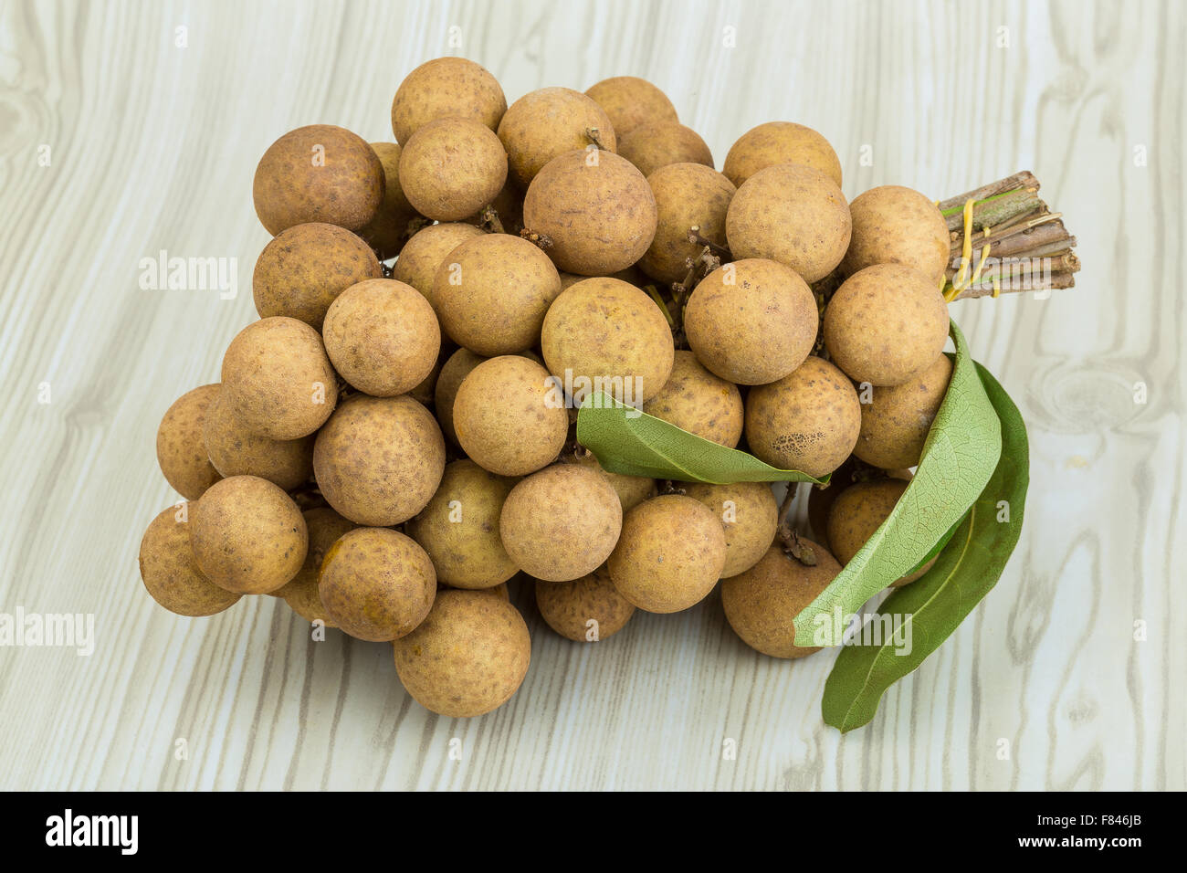 Asian fruit Longan - on wood background Stock Photo - Alamy