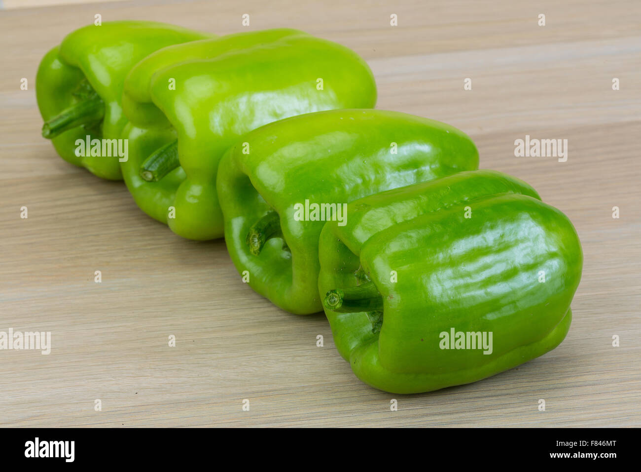 Fresh ripe Green pepper on the wood background Stock Photo - Alamy
