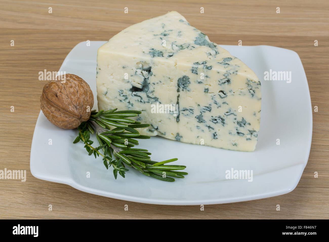 Blue cheese with mold on the wood background Stock Photo - Alamy