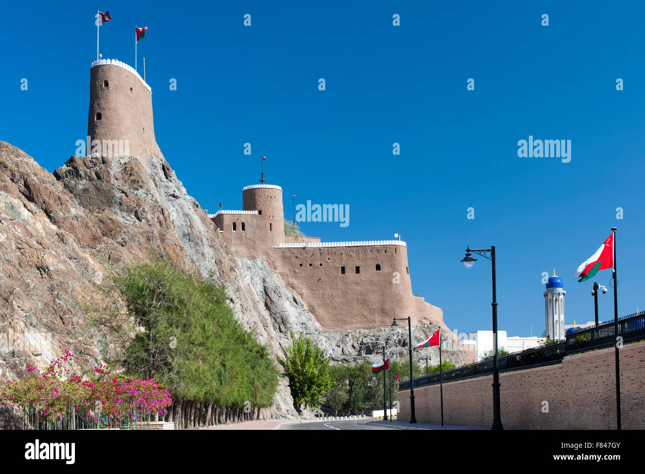 Al Mirani Fort and minaret of the Al Khor Mosque in Old Muscat, part of ...