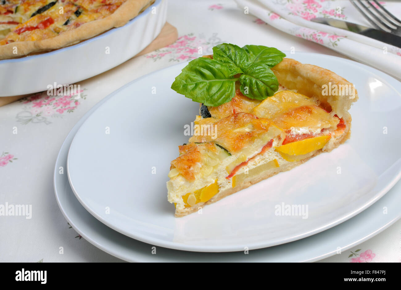 Quiche with zucchini (green, yellow) and tomatoes baked cheese Stock ...