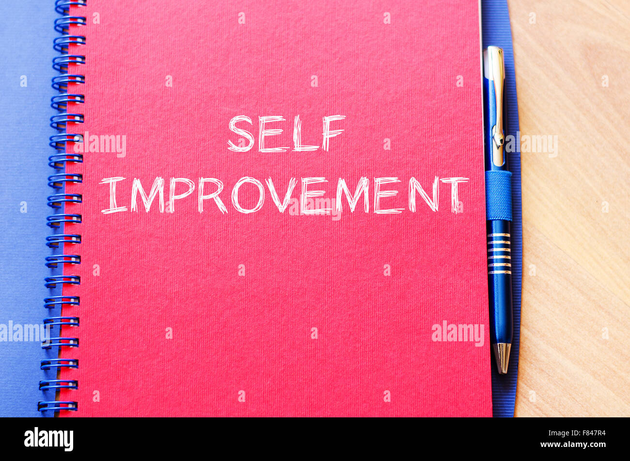 Self improvement text concept write on notebook with pen Stock Photo ...