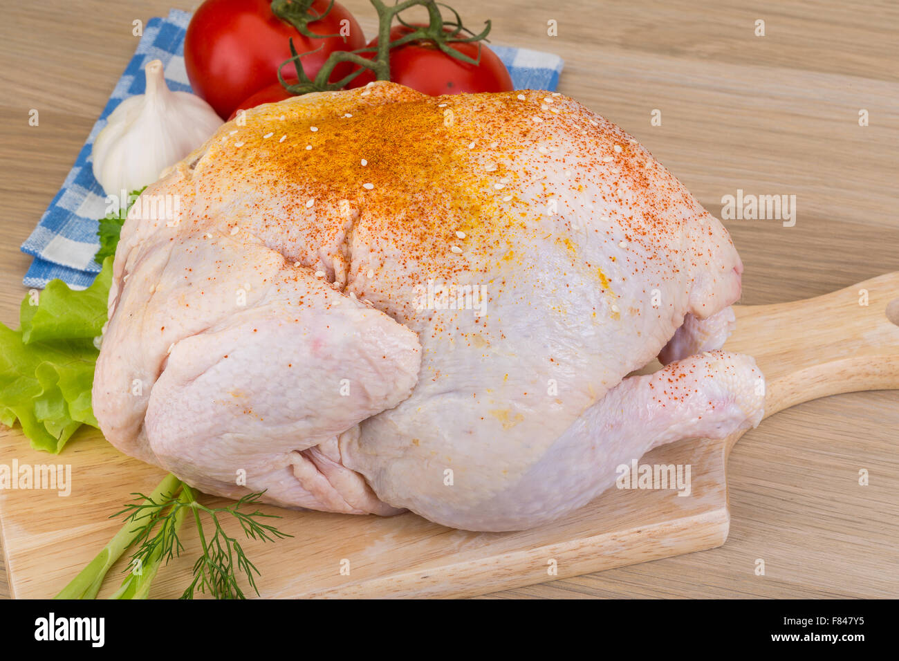 Raw chicken with herbs and spices ready for cooking Stock Photo - Alamy