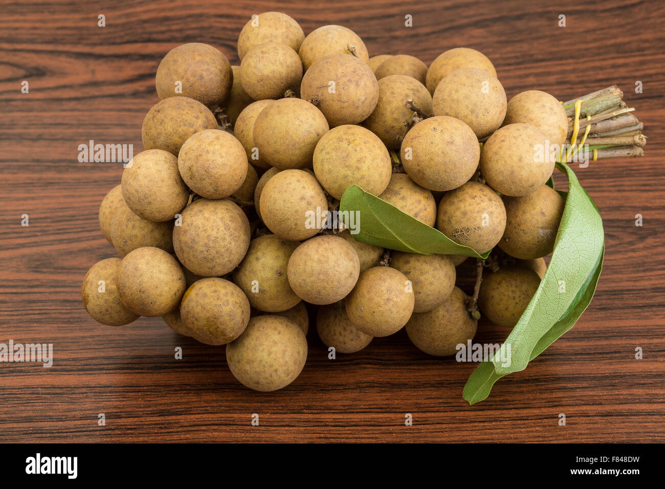 Asian fruit Longan - on wood background Stock Photo - Alamy