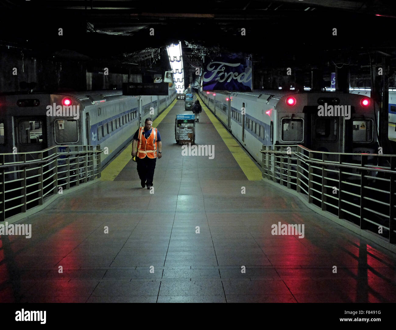 A Metro North commuter train worker on a platform in Grand Central ...