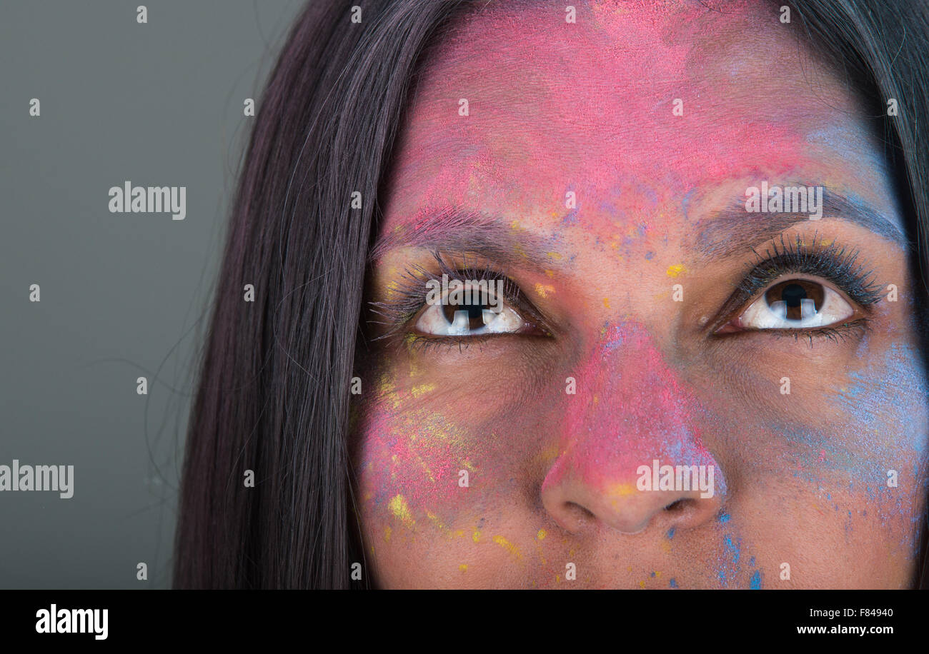 Beautiful young brunette girl with colorful decorated face Stock Photo ...